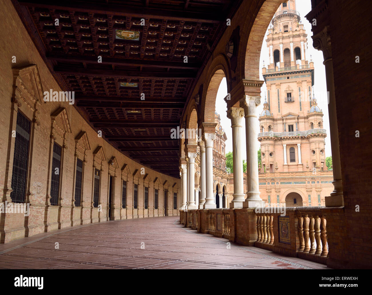 South Tower with curved roofed walkway with pillars at Plaza de Espana ...