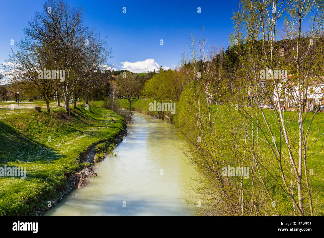 The tranquility of a quiet river in the countryside of the hills during ...