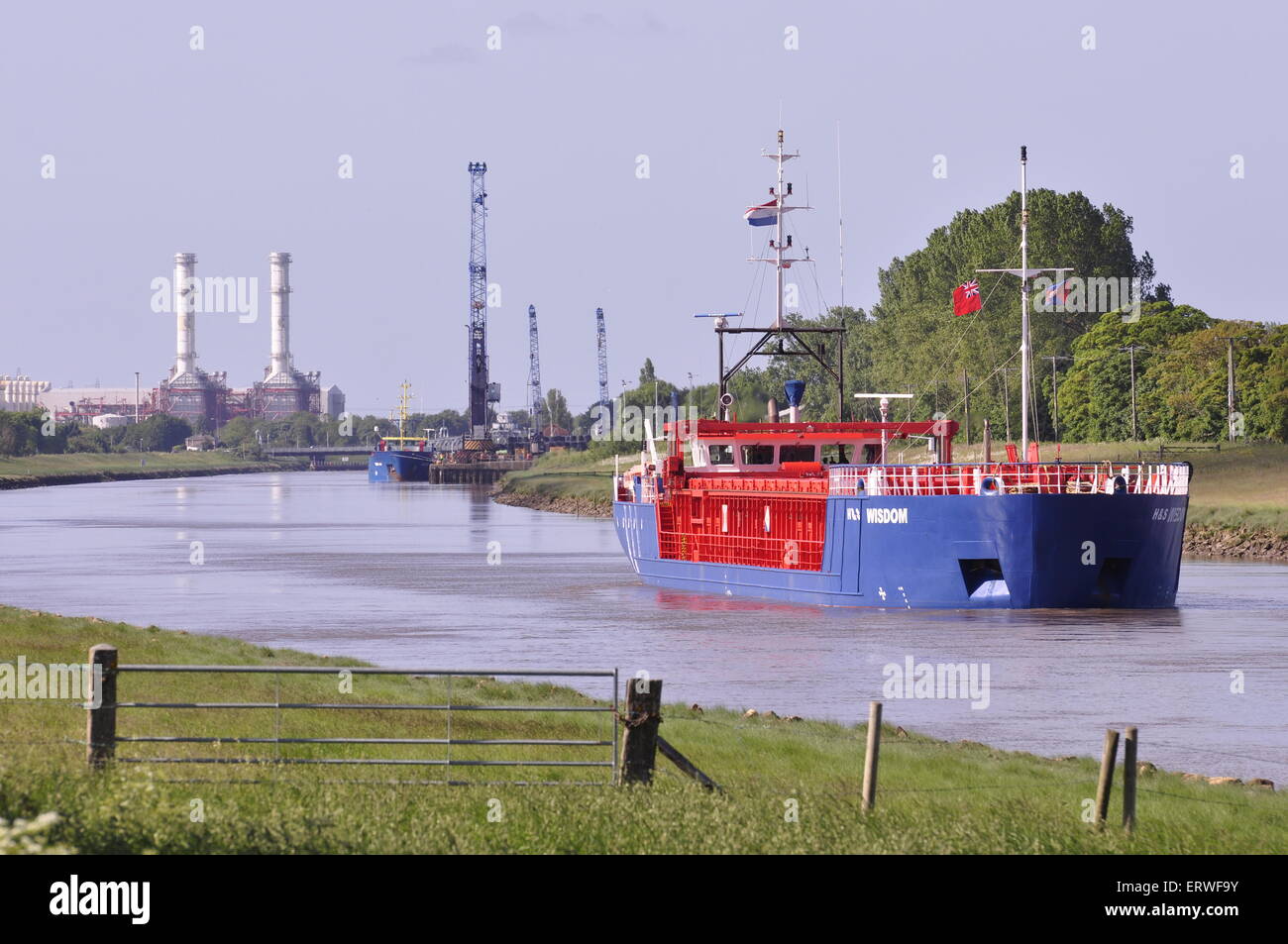 Ship motoring astern approaching Port Sutton Bridge on the River Nene ...
