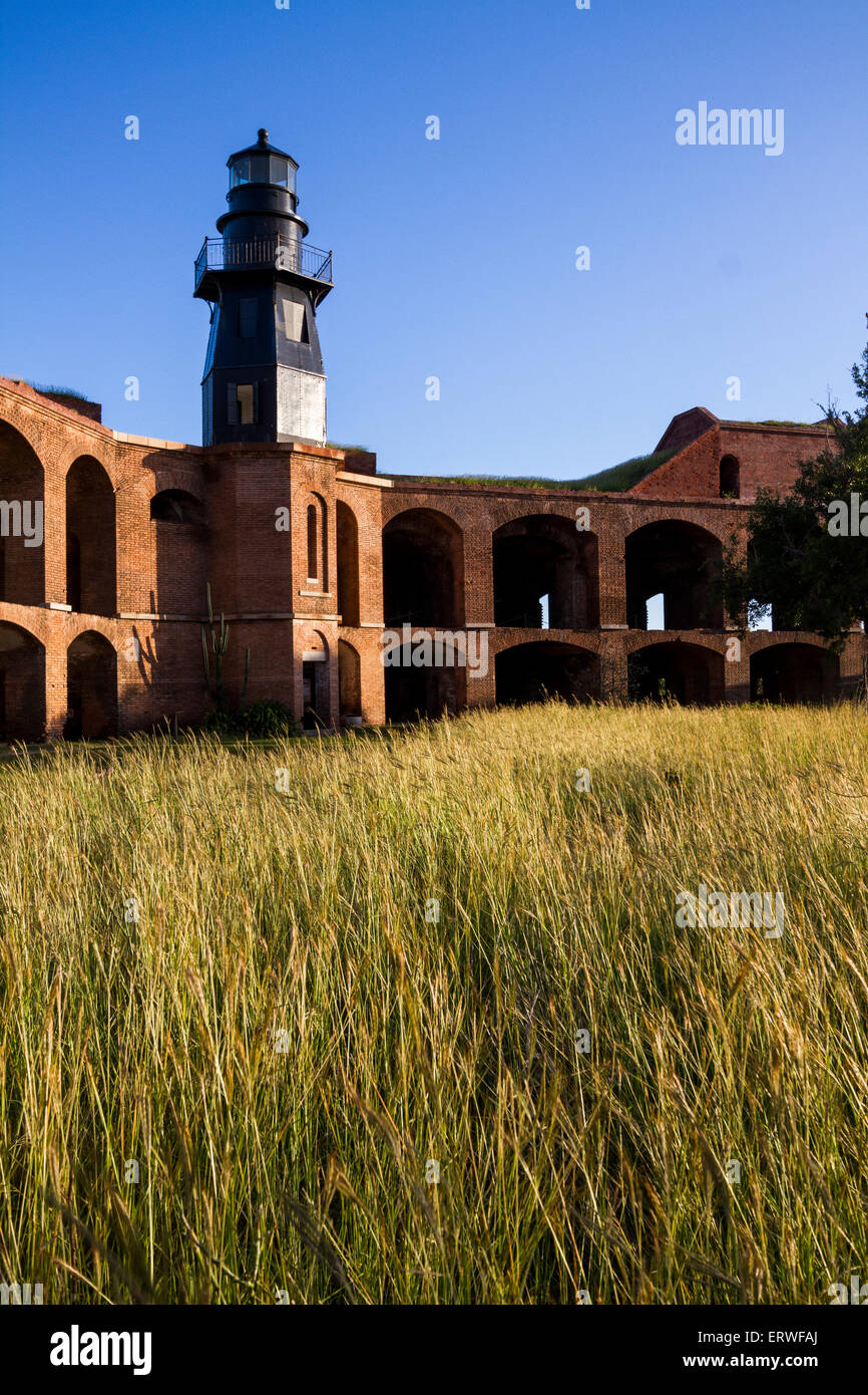 Evening light on the lighthouse and walls of Fort Jefferson, Dry ...