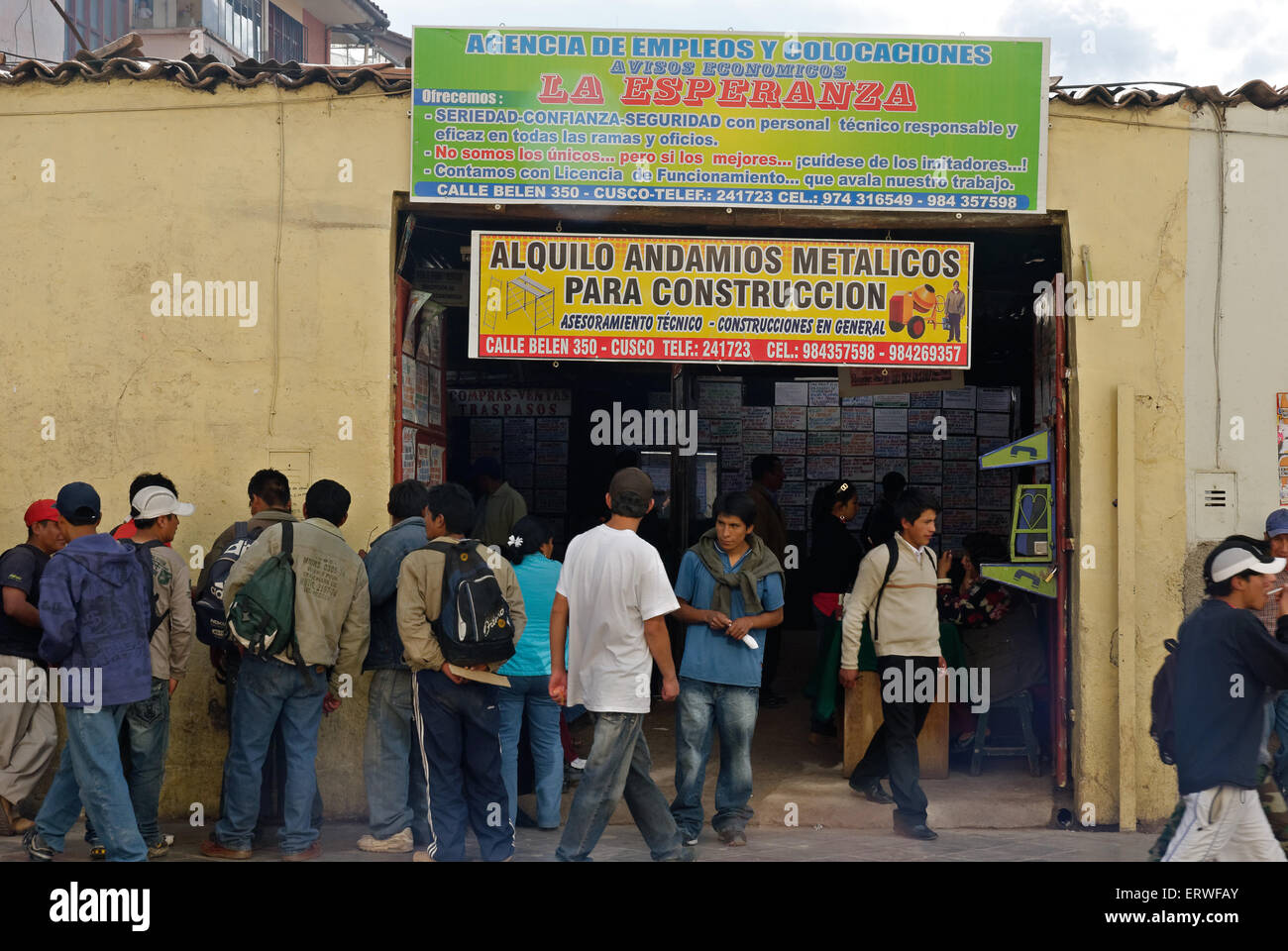 A queue of men waiting outside a job centre in Cusco, Peru Stock Photo ...