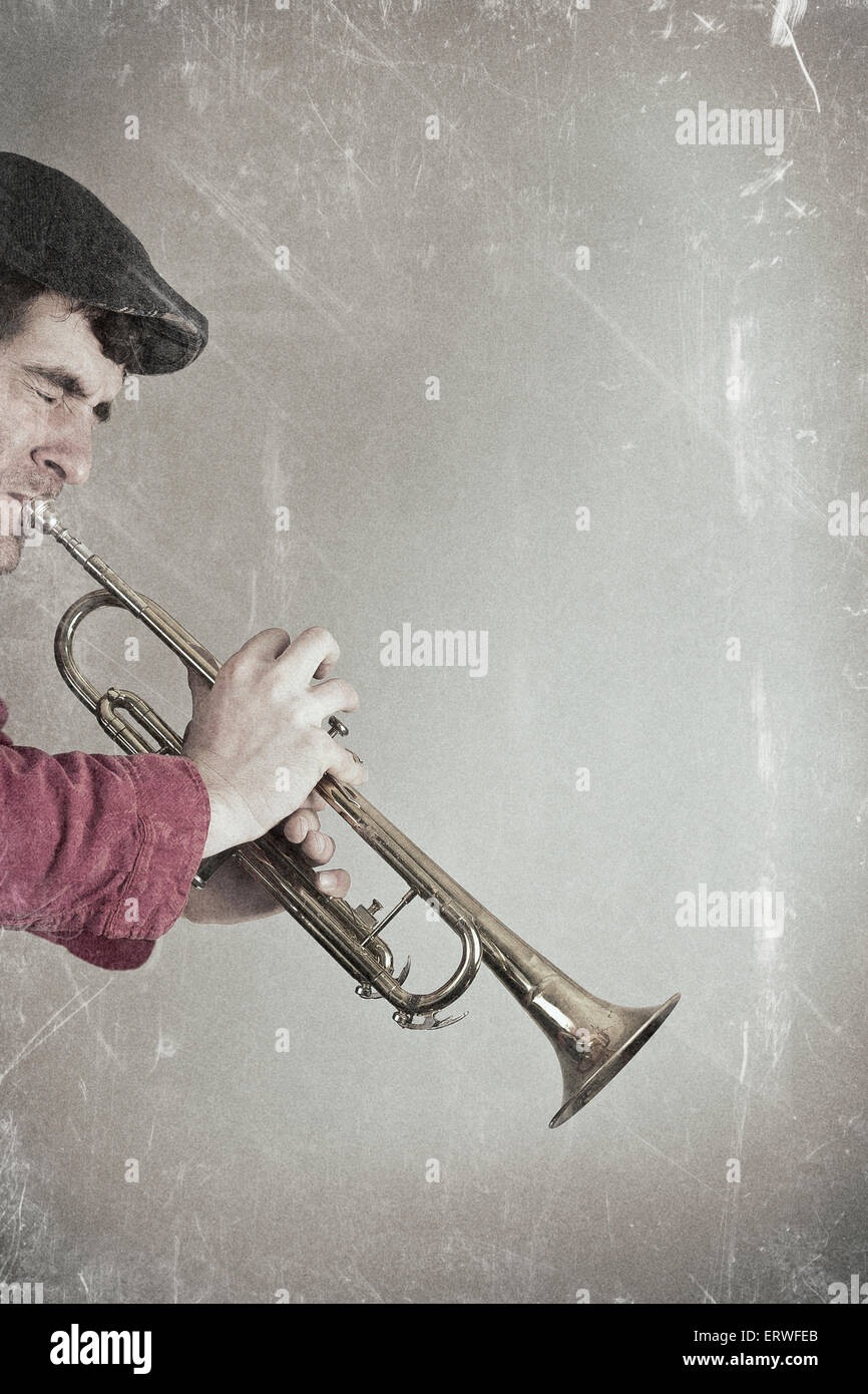 Horn musician playing high note in vintage style photo with copyspace ...