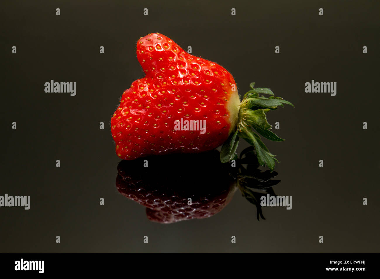 strawberry shaped hand with thumb up Stock Photo - Alamy