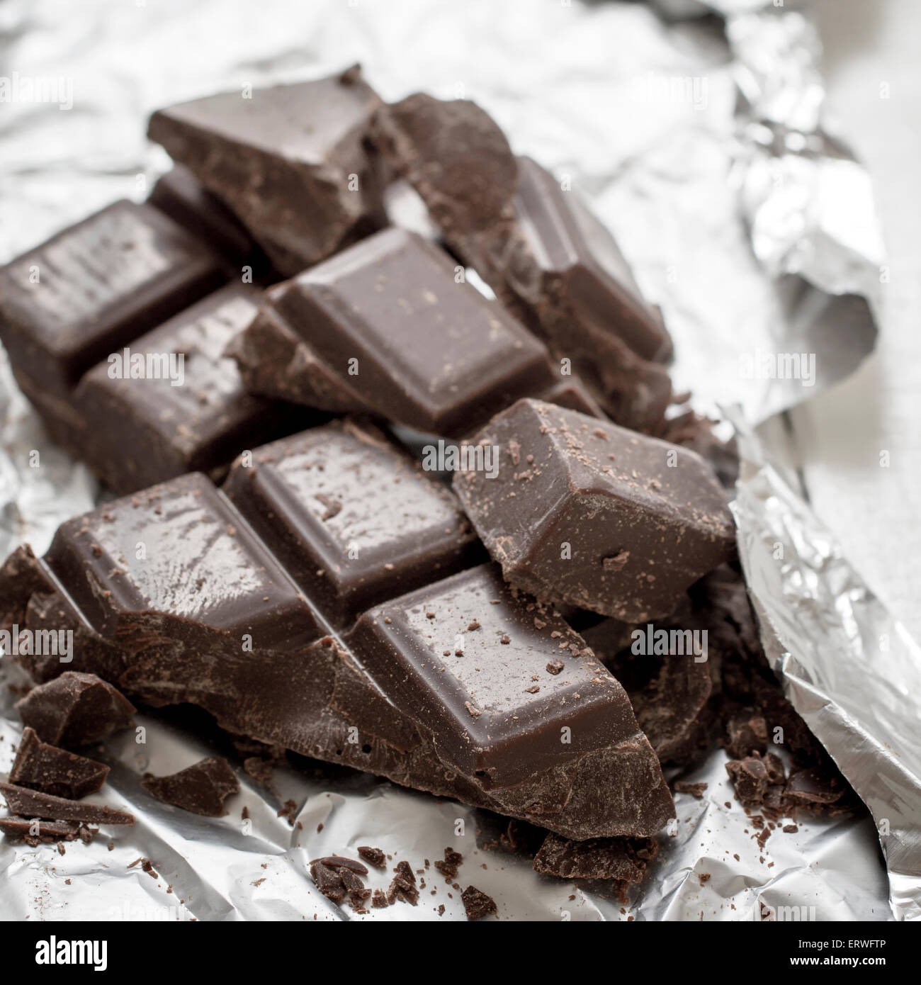 Stack of milk chocolate pieces hi-res stock photography and images - Alamy