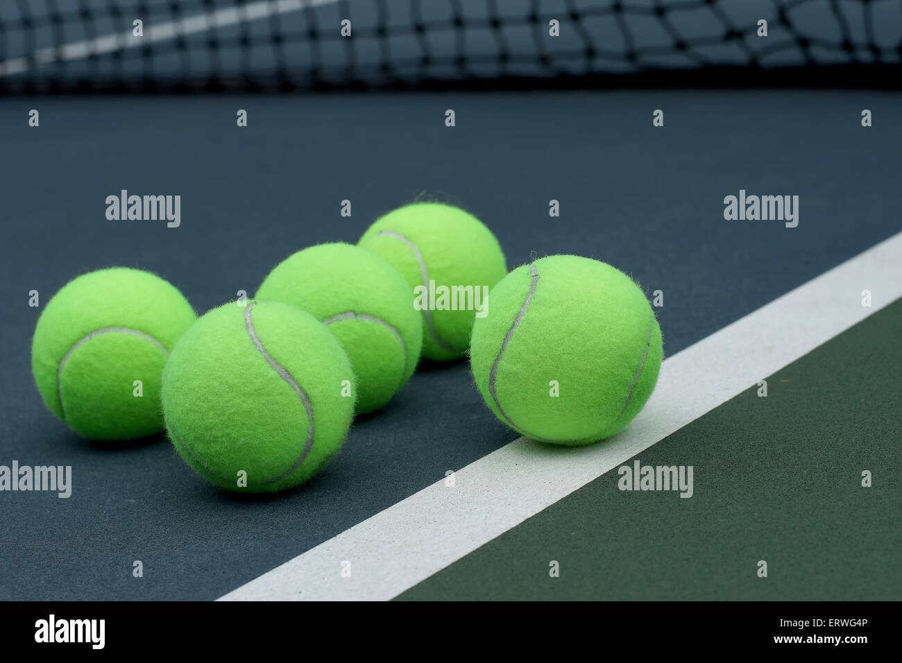 pile of tennis ball on court background Stock Photo - Alamy