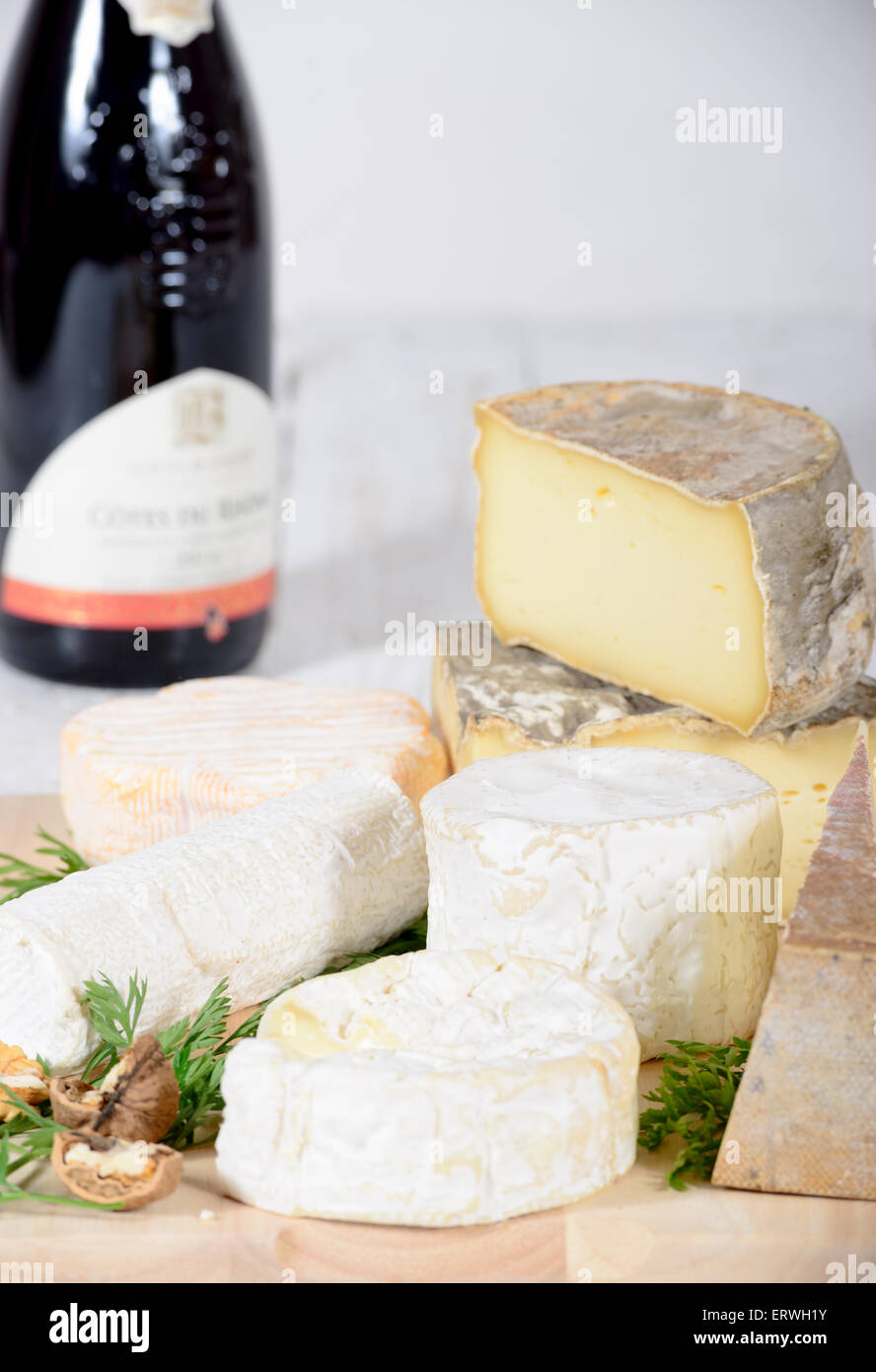 different french cheeses with bottle of wine Stock Photo - Alamy