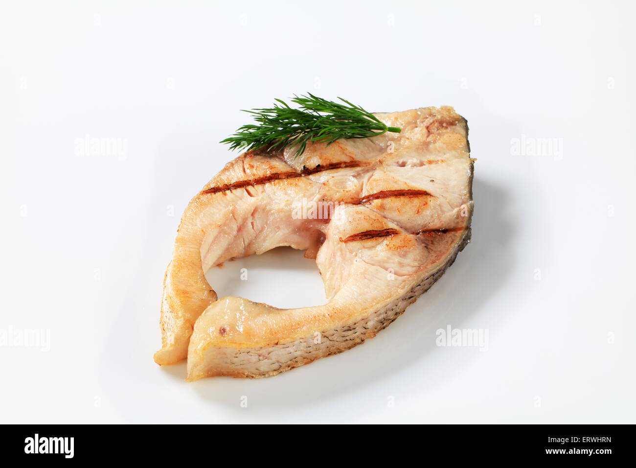 Studio shot of grilled fish steak Stock Photo - Alamy