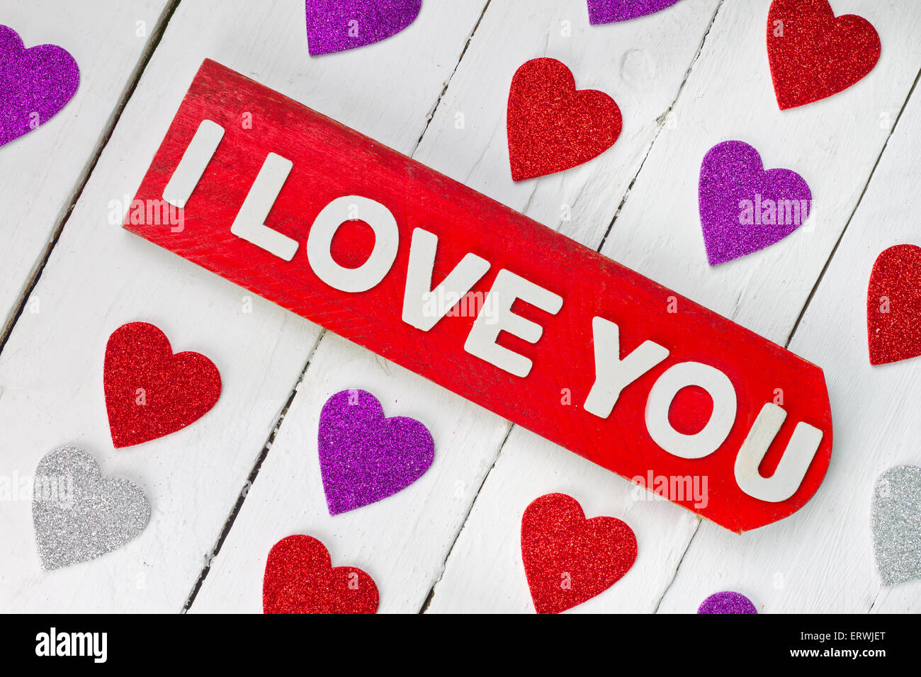 I love you words on white background with red and purple hearts Stock ...