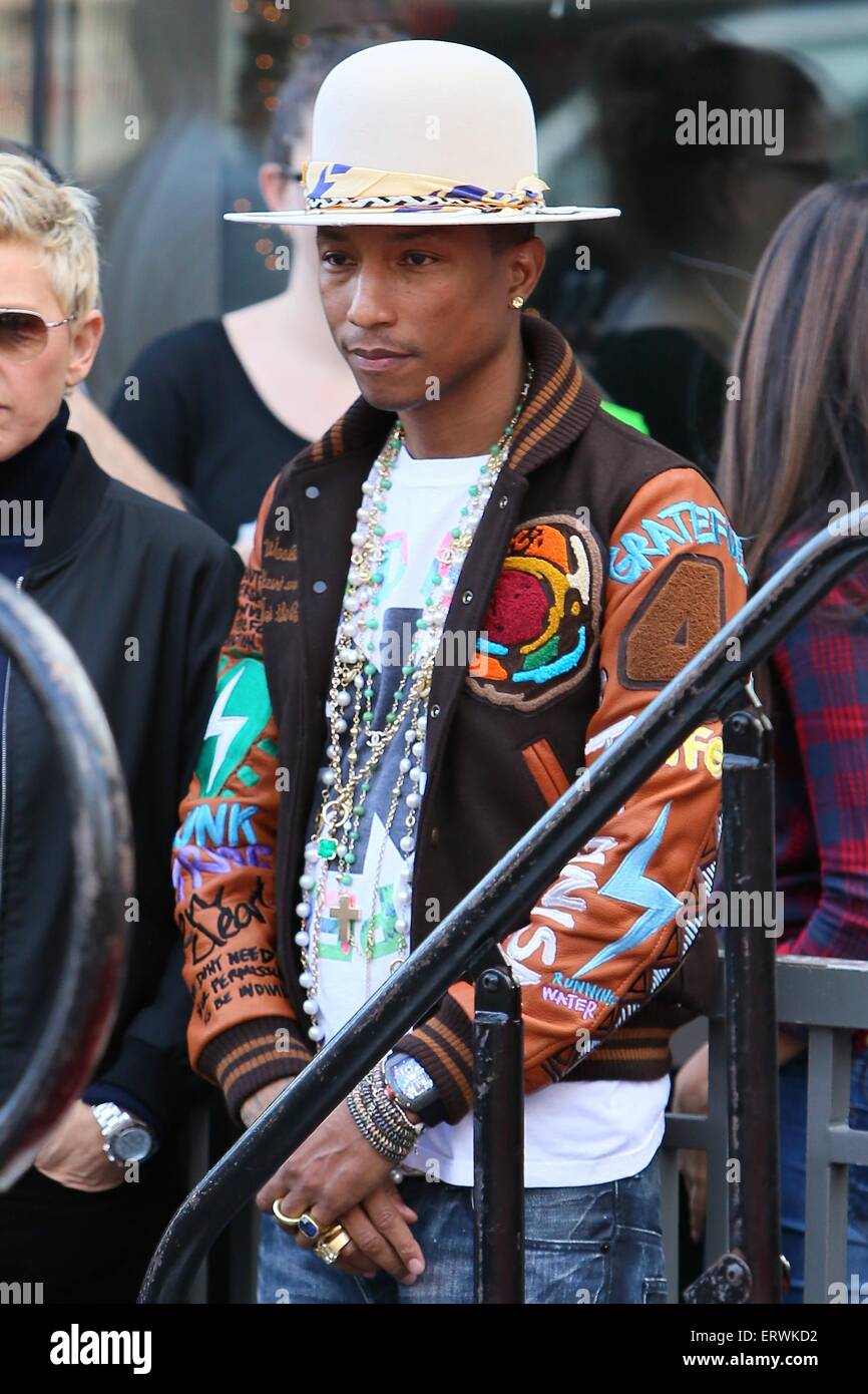 Pharrell Williams is presented with a star on the Hollywood walk of ...