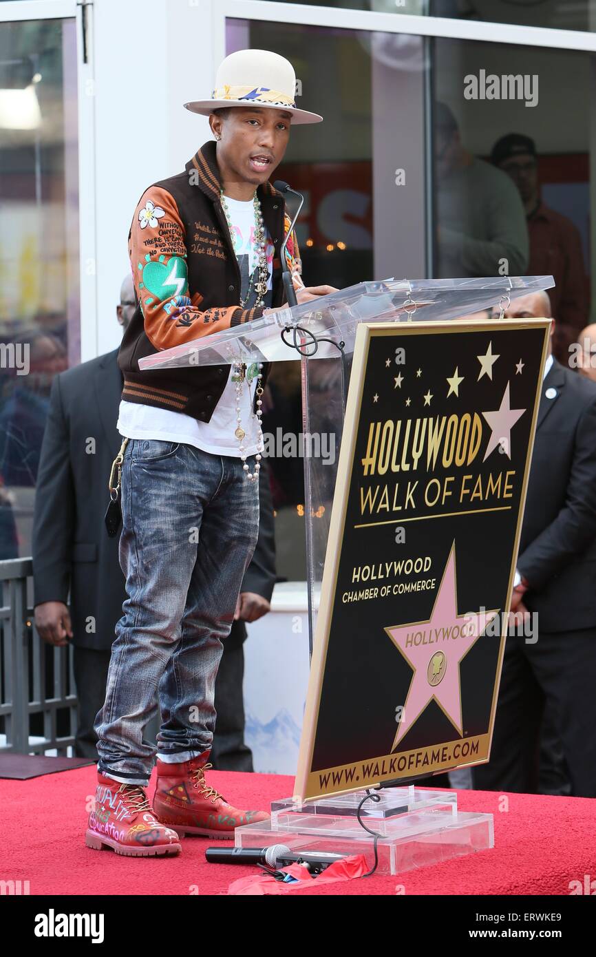 Pharrell Williams is presented with a star on the Hollywood walk of ...