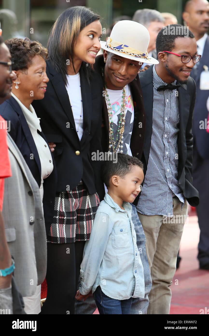Pharrell Williams is presented with a star on the Hollywood walk of ...
