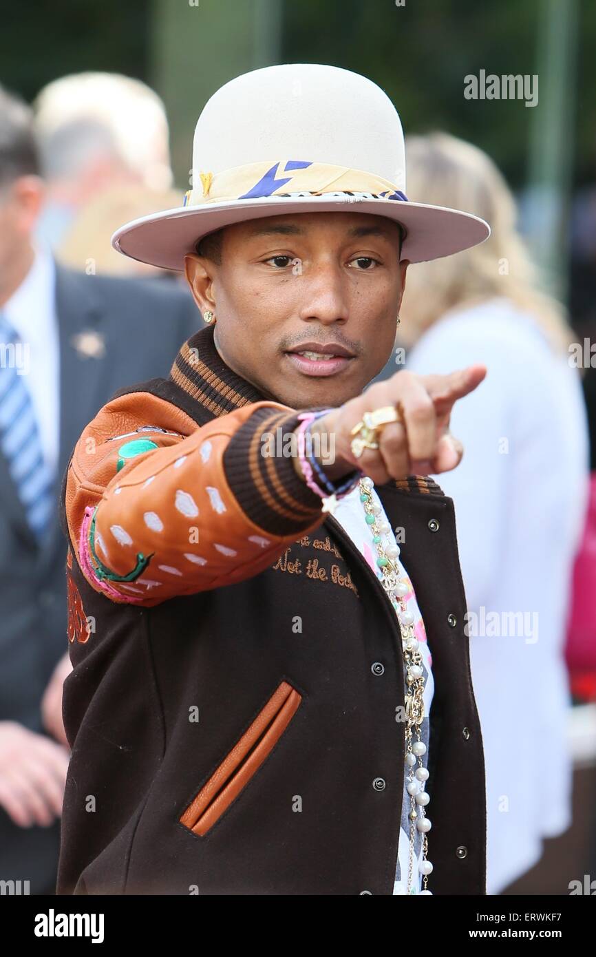 Pharrell Williams is presented with a star on the Hollywood walk of ...