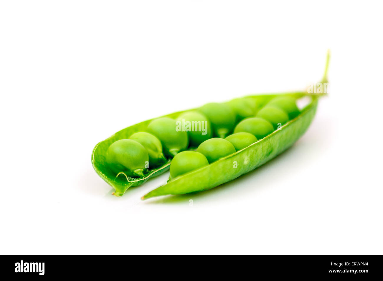 Many raw open pea isolated on white background Stock Photo - Alamy
