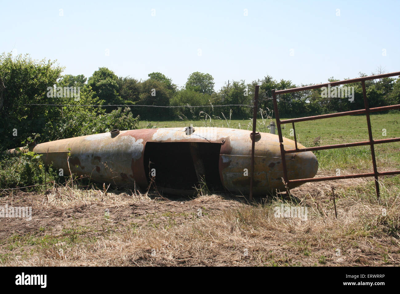 WWII bomb used to block field gate. Normandy France Stock Photo - Alamy