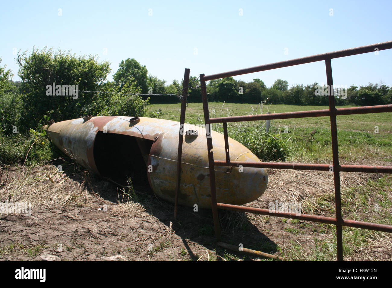 WWII bomb used to block field gate. Normandy France Stock Photo - Alamy