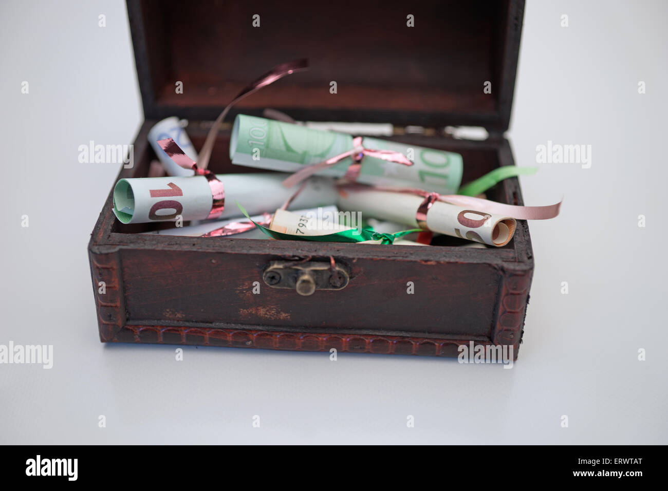 Old wooden chest with Euro currency inside Stock Photo - Alamy