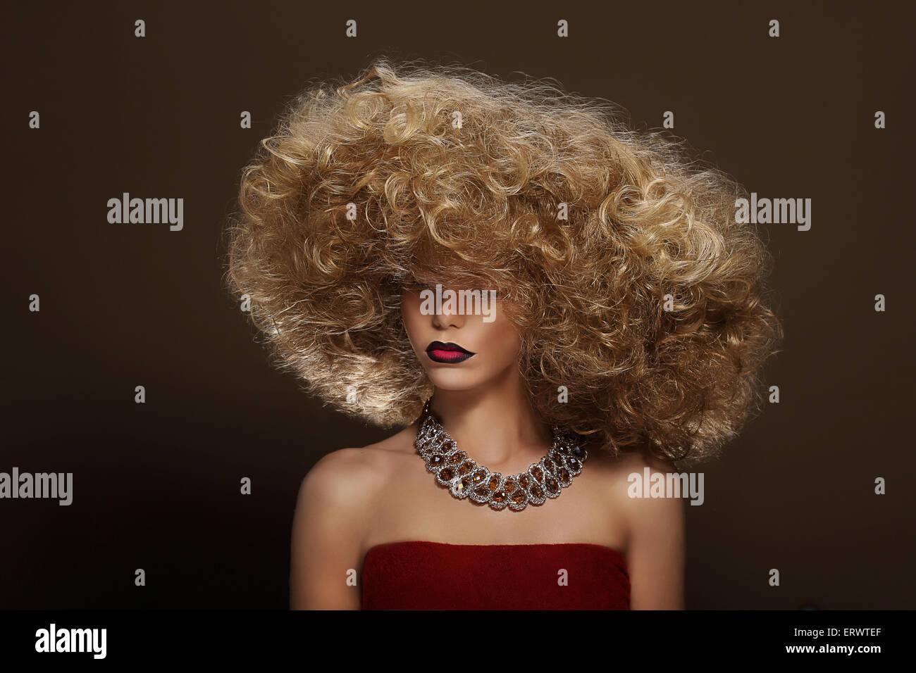 Glamor. Classy Gorgeous Woman with Curly Permed Hairs Stock Photo - Alamy