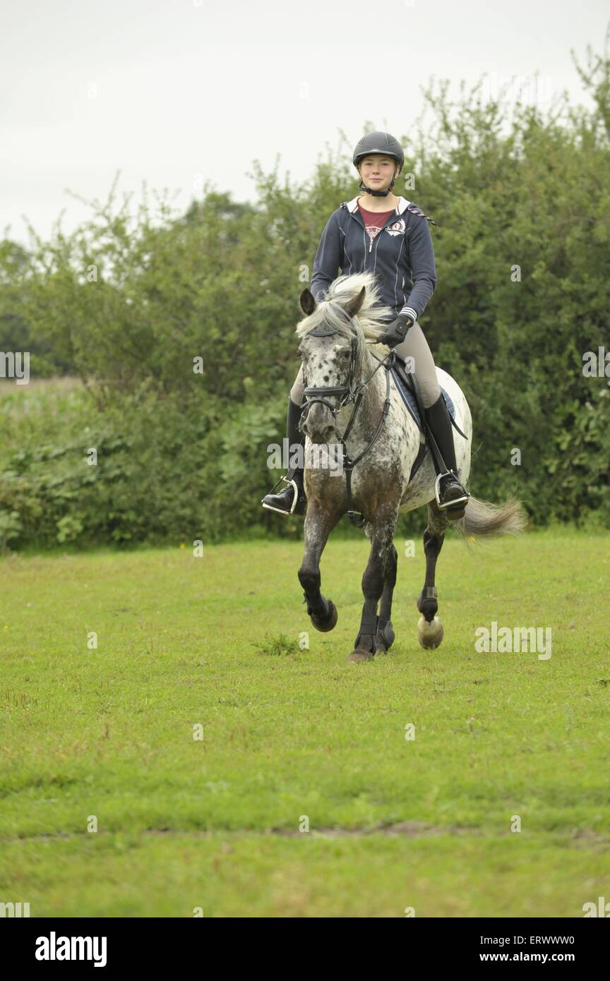 girl rides pony Stock Photo - Alamy