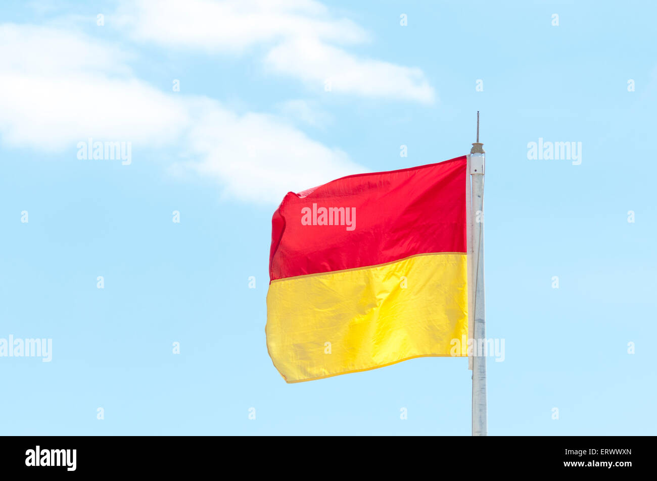 Red and yellow safety flag indicating a beach that has lifeguards Stock ...