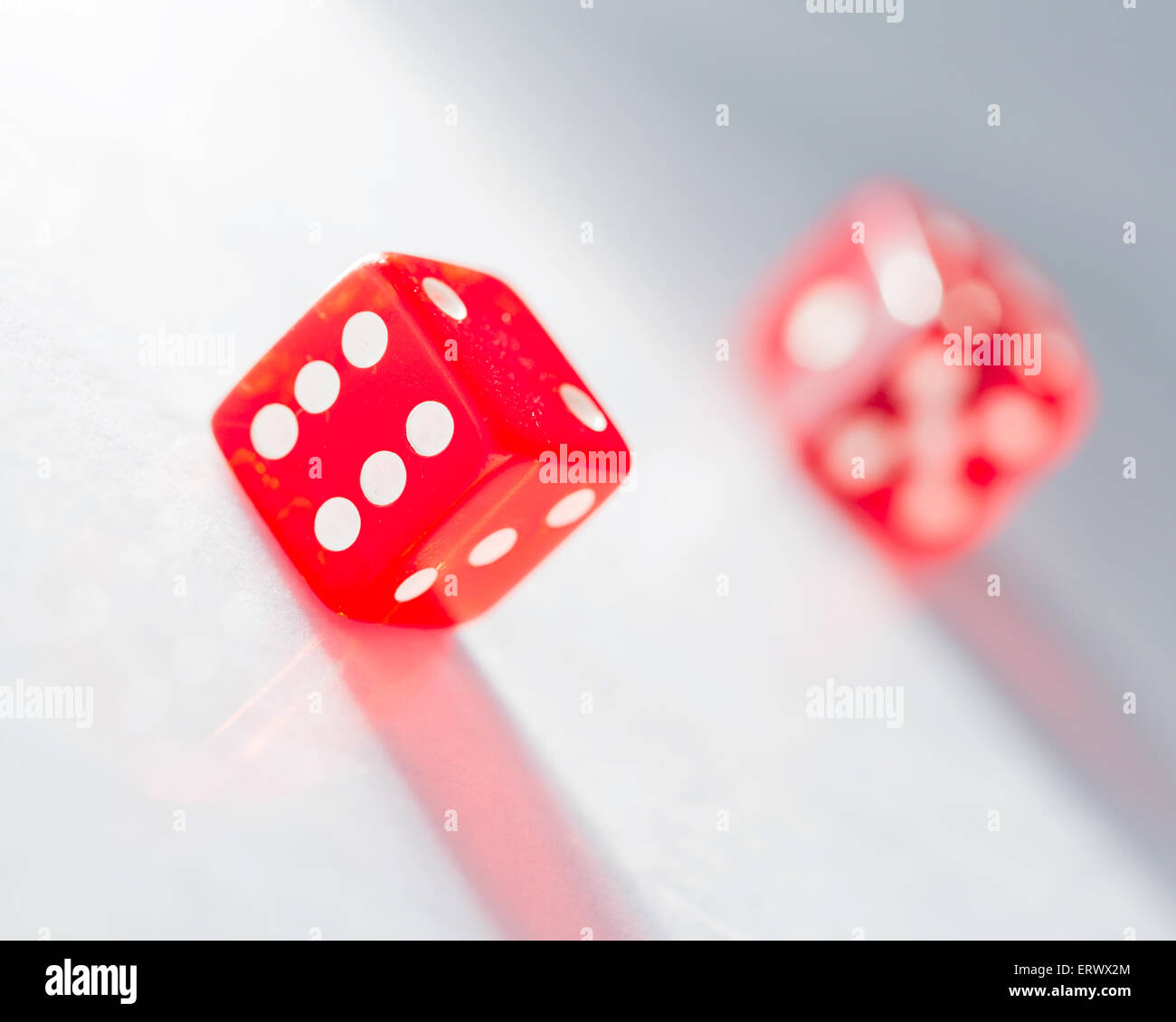 two red the dice on a light background Stock Photo - Alamy