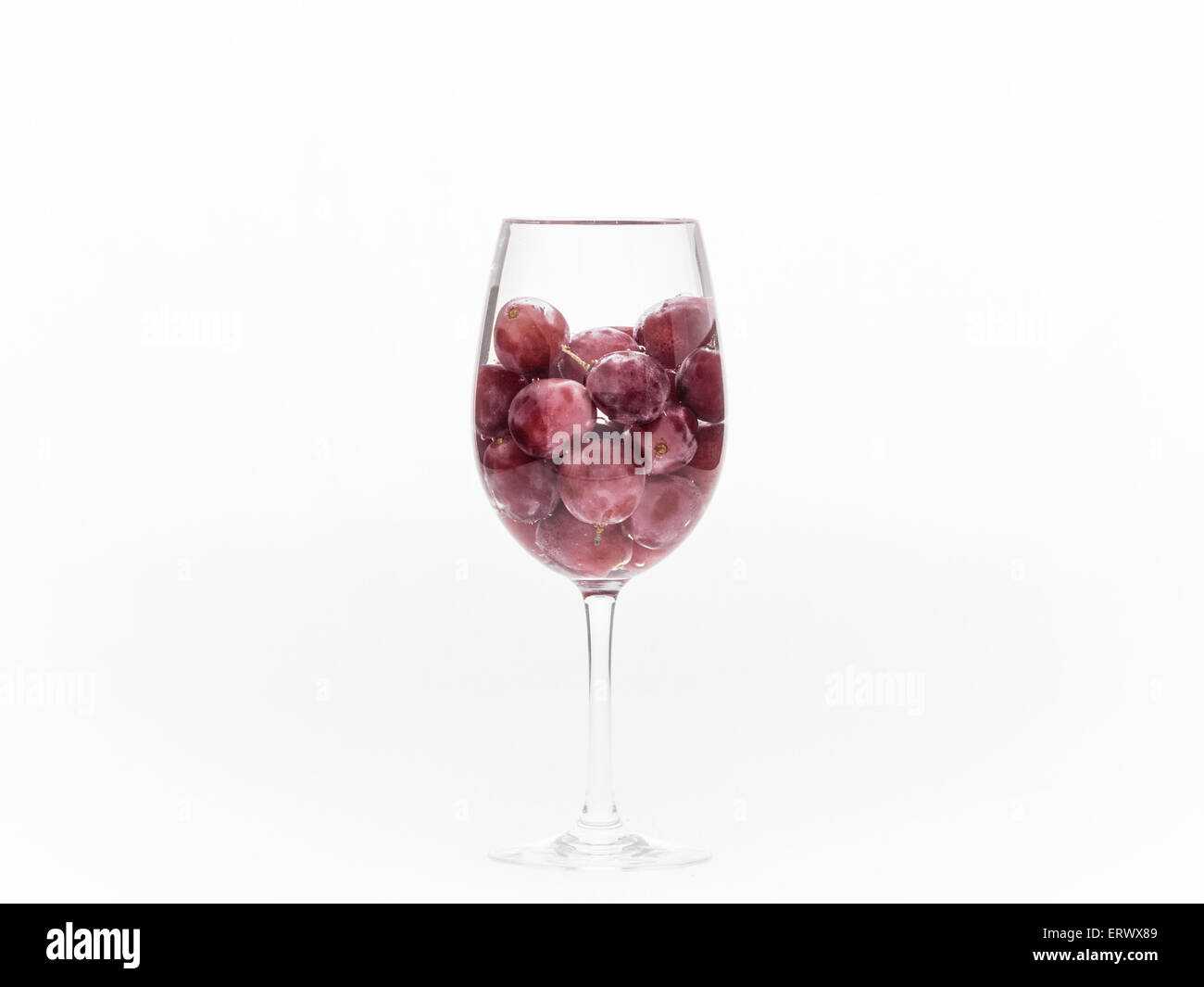 Red grapes in wine glass Stock Photo - Alamy