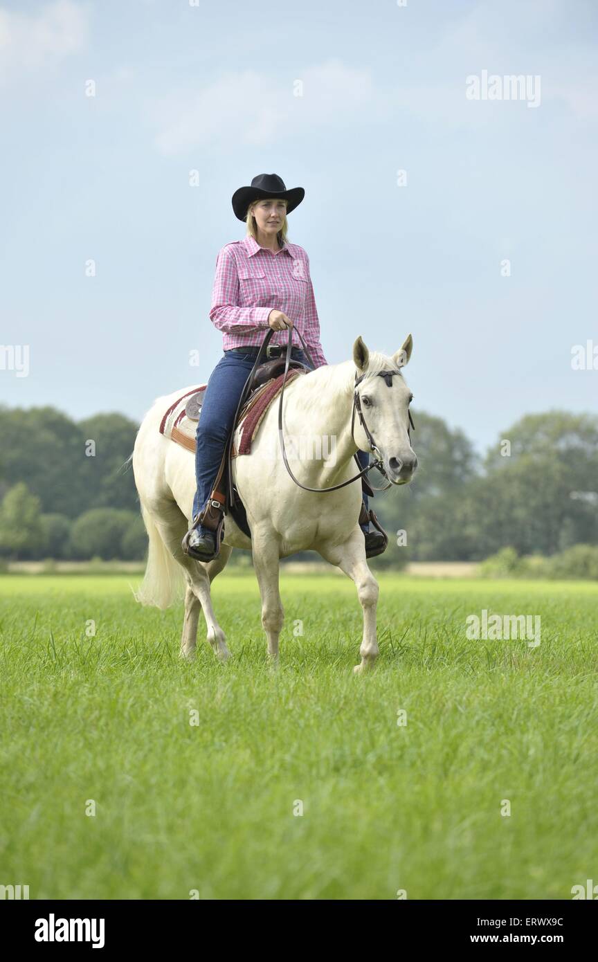 woman rides Quarter Horse Stock Photo - Alamy