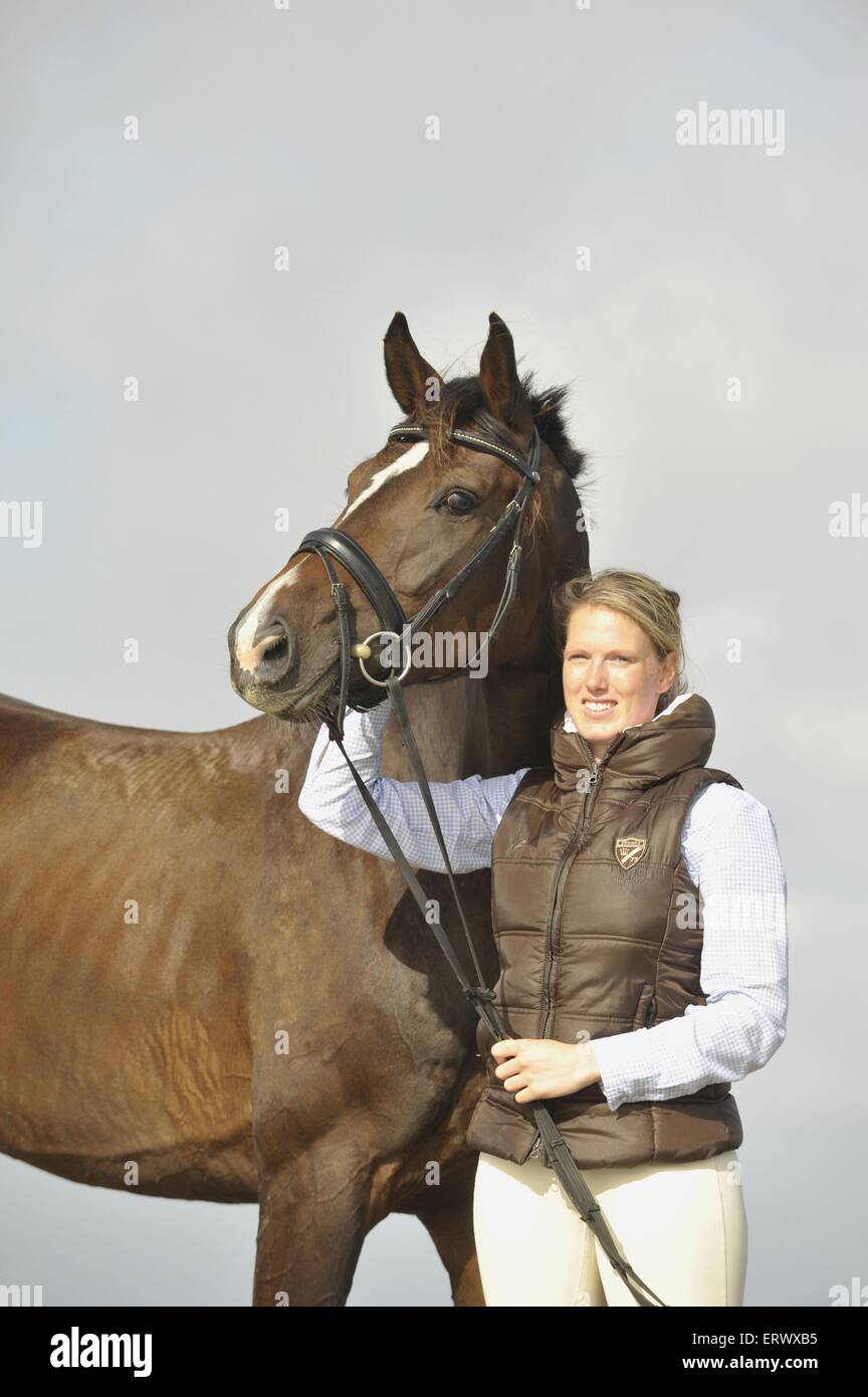 woman with Holsteiner warmblood Stock Photo - Alamy
