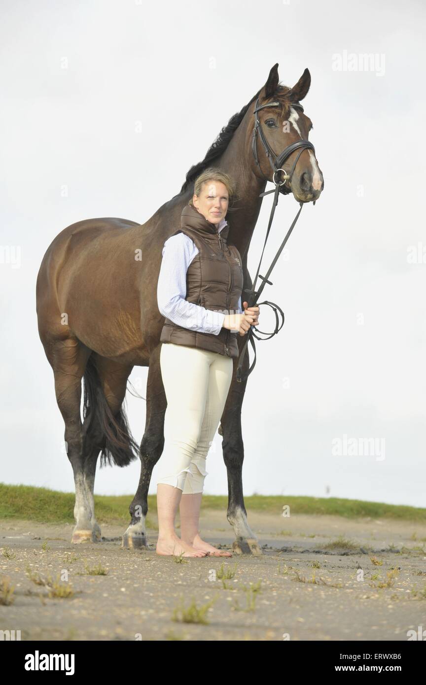 woman with Holsteiner warmblood Stock Photo - Alamy