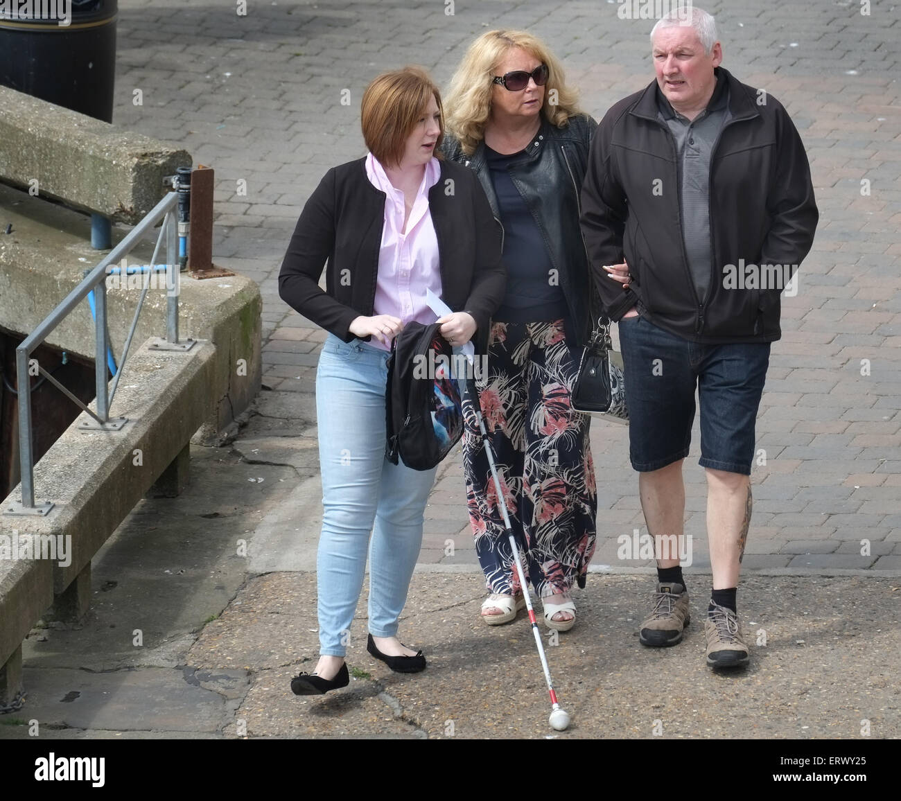 Blind lady with family walking Stock Photo - Alamy