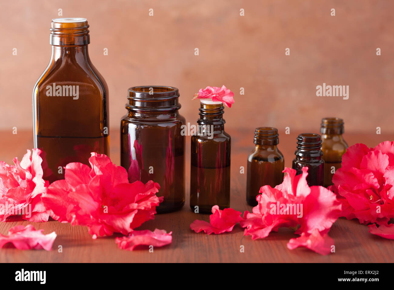 essential oil azalea flowers on dark rustic background Stock Photo - Alamy