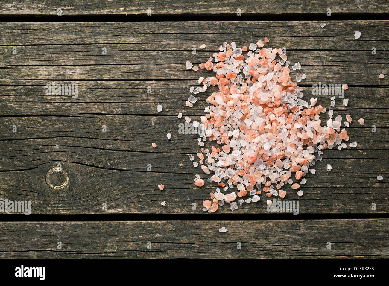 Himalayan salt on old wooden table Stock Photo - Alamy