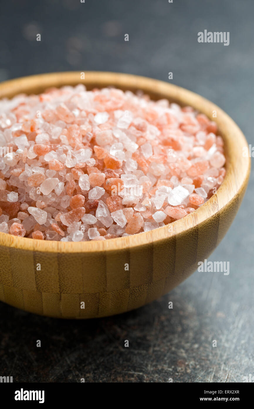 Himalayan salt in wooden bowl Stock Photo - Alamy