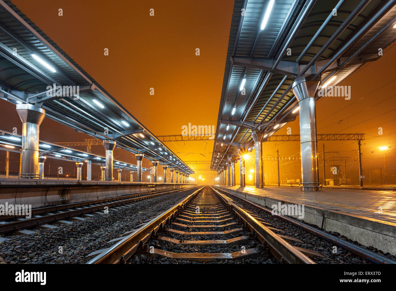 Railway station at night. Train platform in fog. Railroad in Donetsk ...