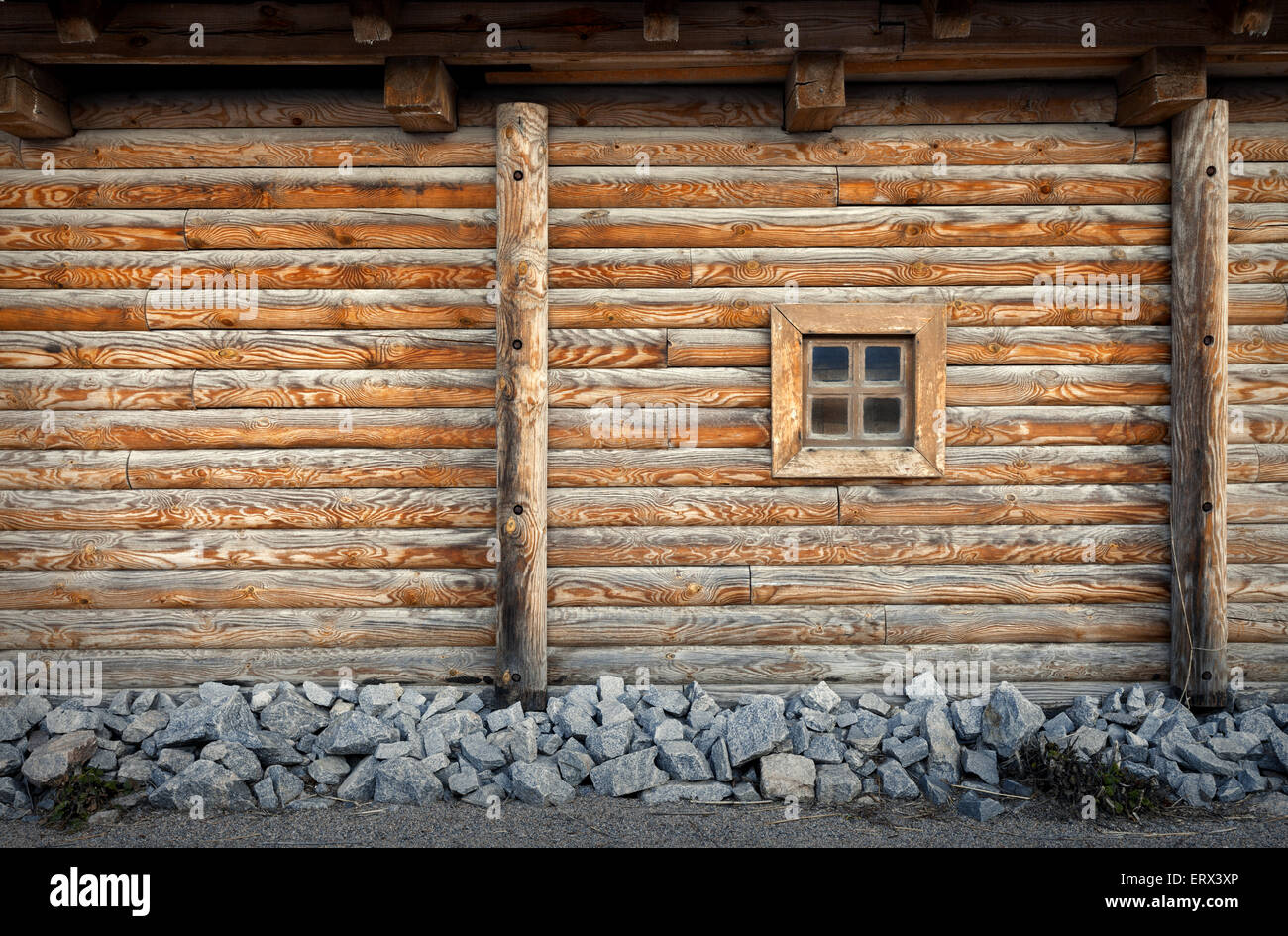 Old window of the old wooden house on the background of wooden walls ...