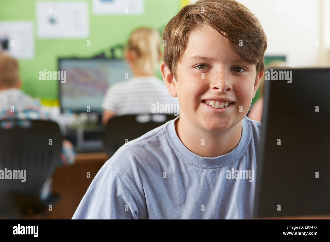 Male Elementary School Pupil In Computer Class Stock Photo - Alamy
