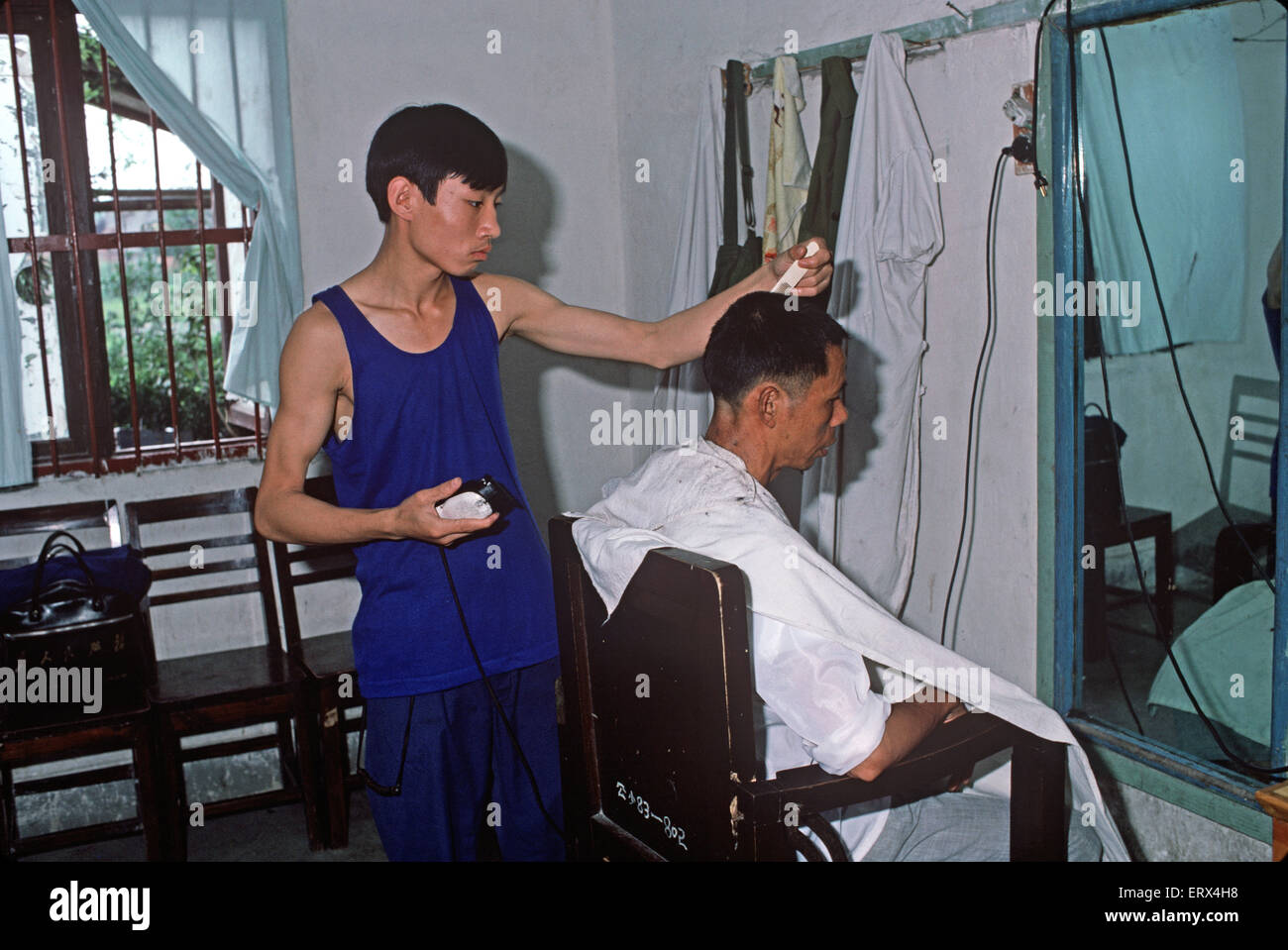 Prisoner barber in Chinese Youth Detention Center, Chengdu, China ...