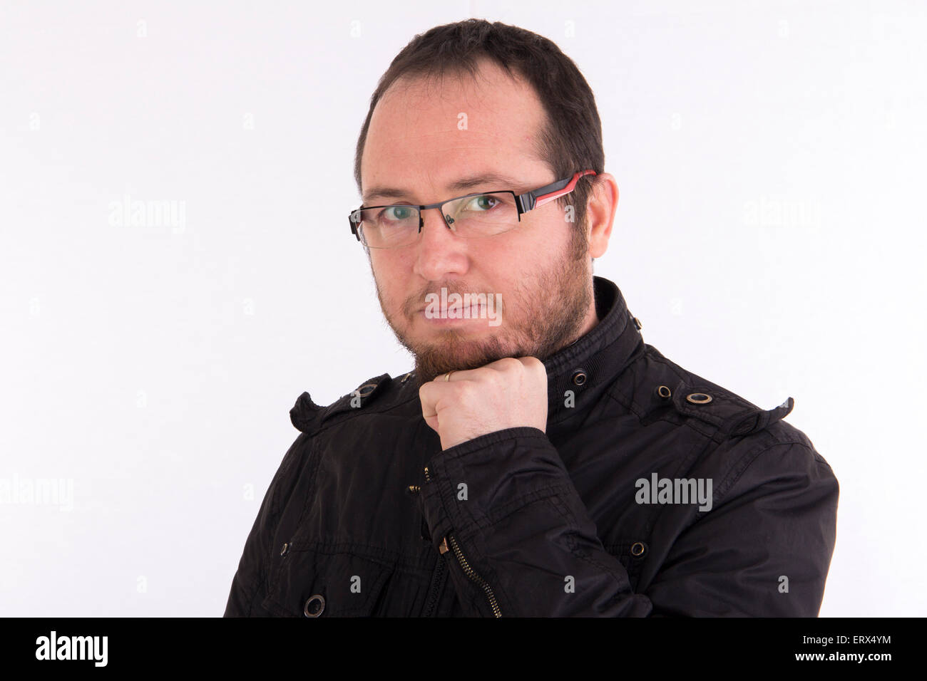 portrait of handsome young man wearing glasses against white background ...