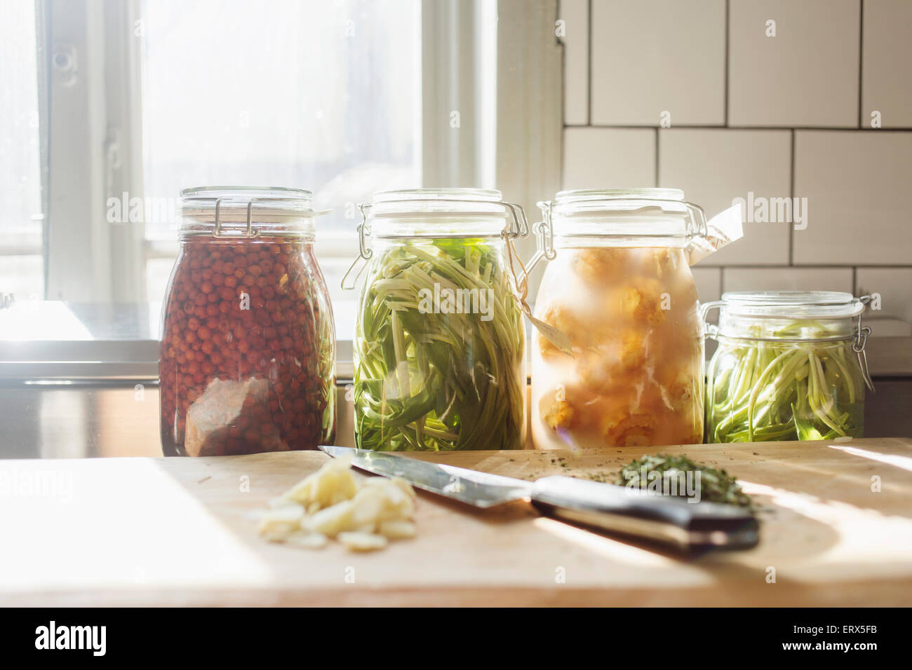Food preserved in jars at commercial kitchen Stock Photo - Alamy