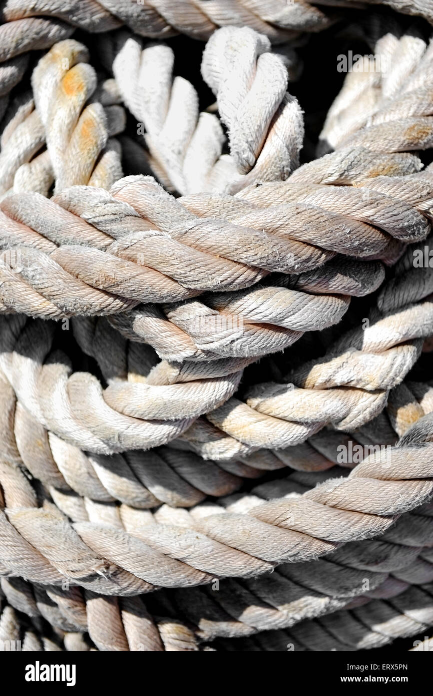 Industrial detail with a heap of old maritime sea ropes Stock Photo - Alamy