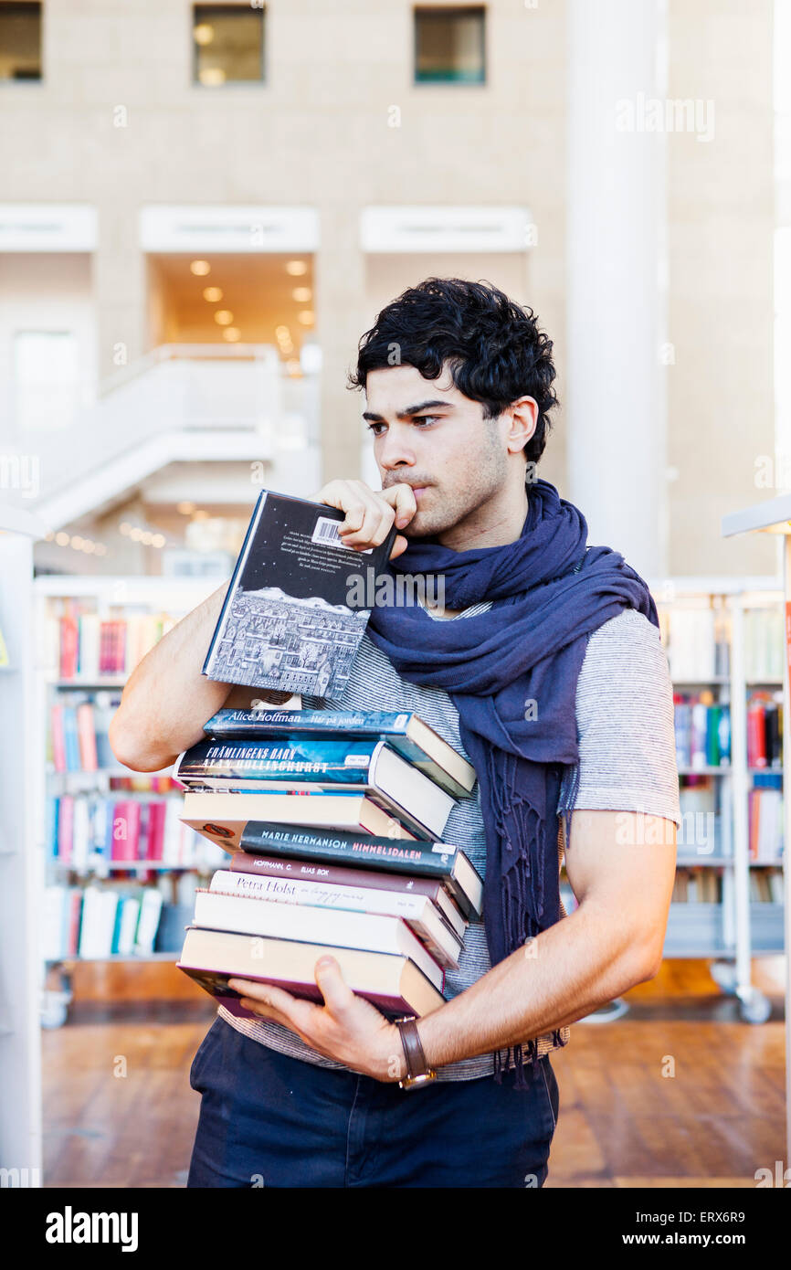 Man holding books hi-res stock photography and images - Alamy