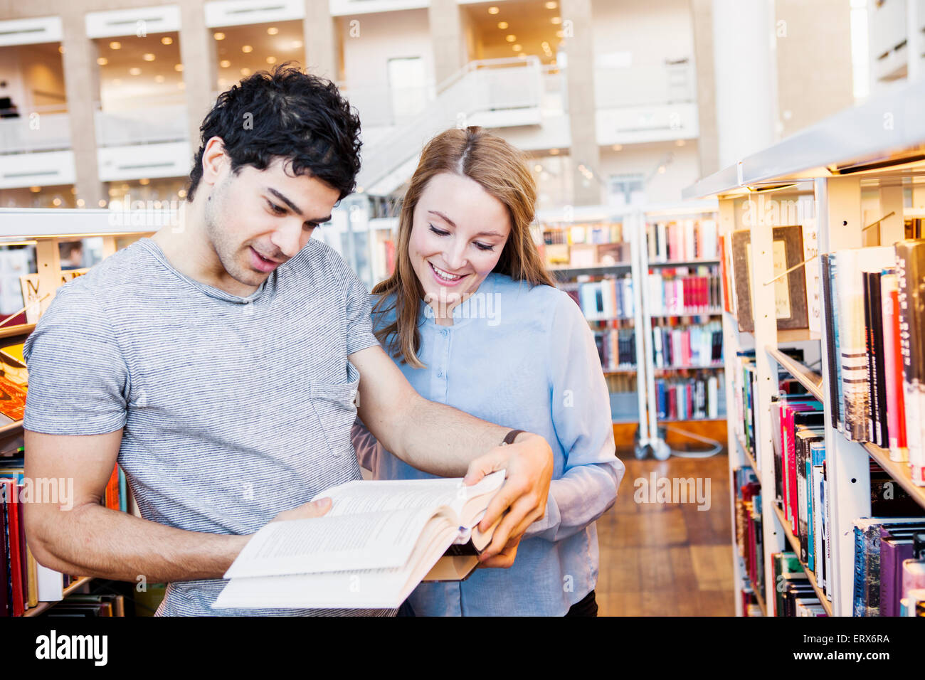 Two adults reading in library hi-res stock photography and images - Alamy