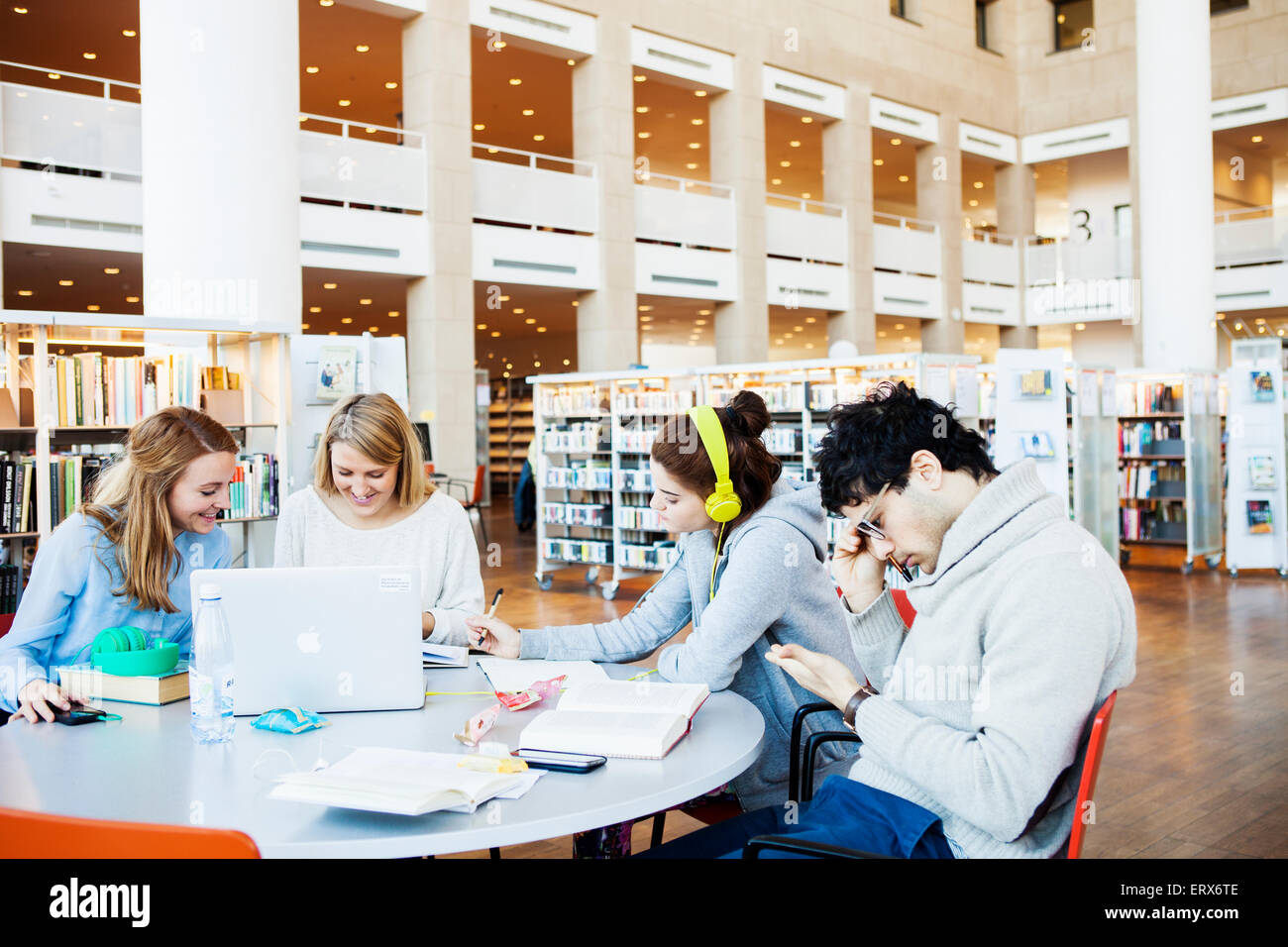 Man woman sitting laptop headphone hi-res stock photography and images ...