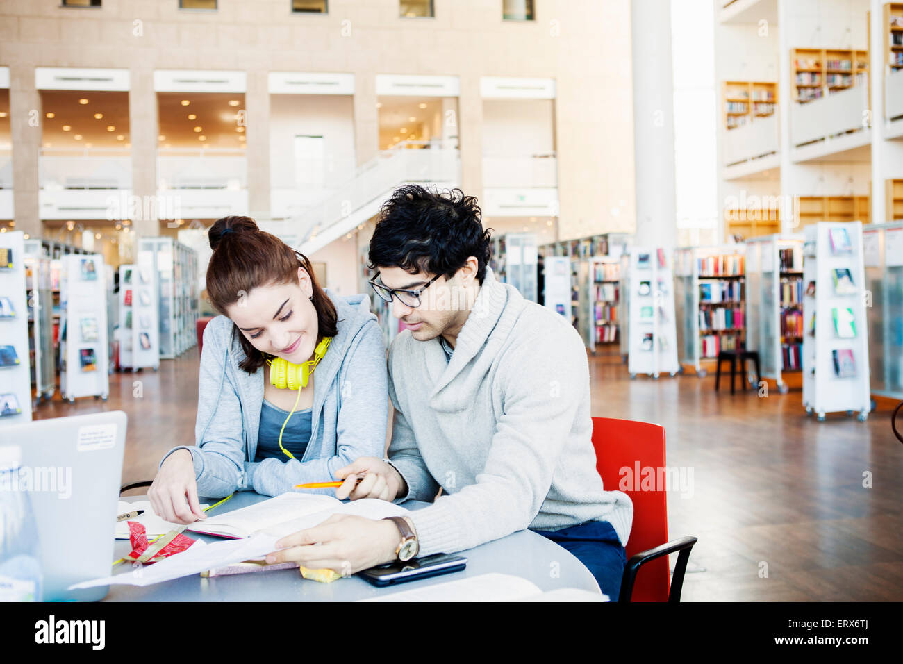 Two adults reading in library hi-res stock photography and images - Alamy
