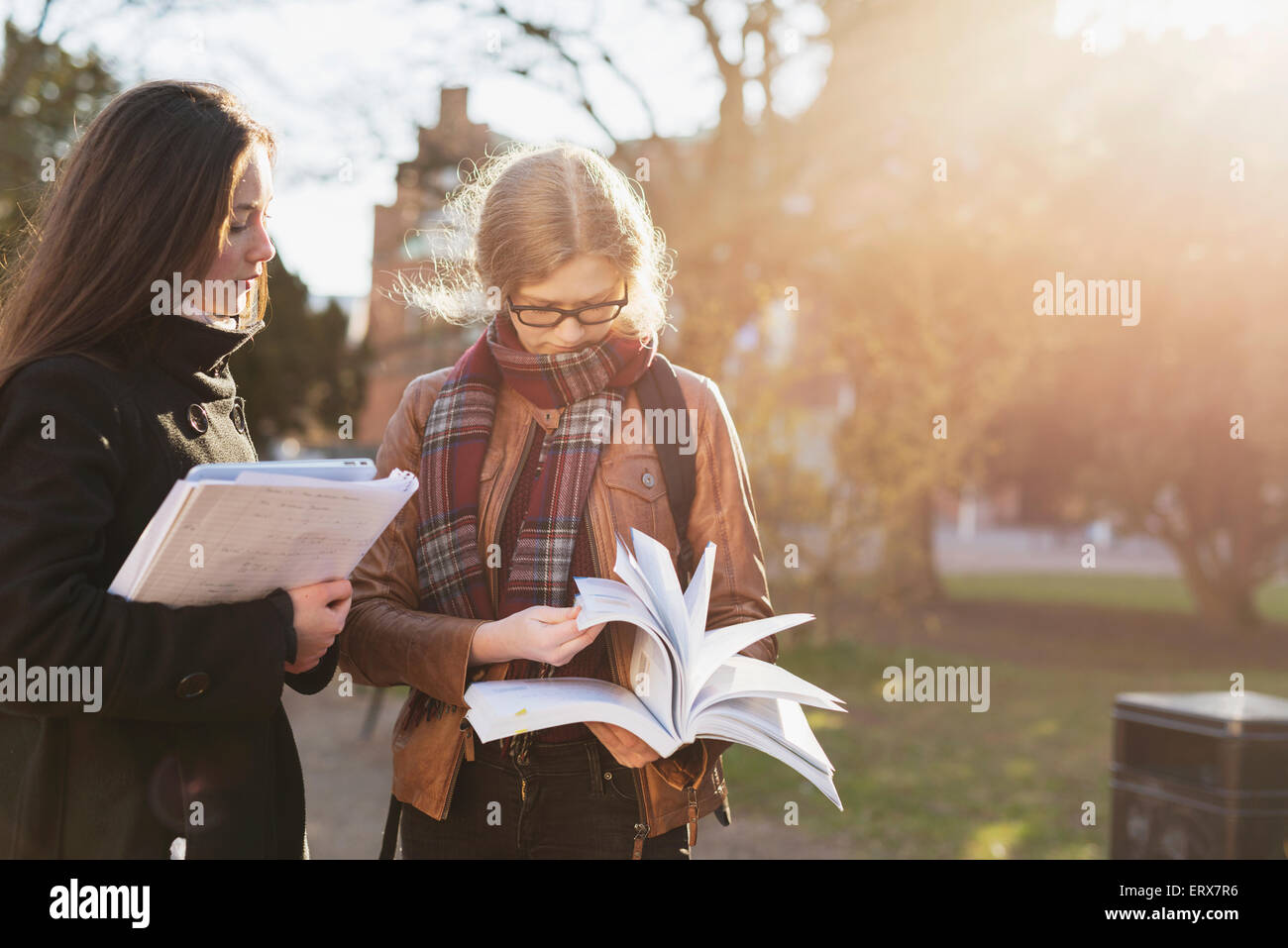 Three student turning pages hi-res stock photography and images - Alamy