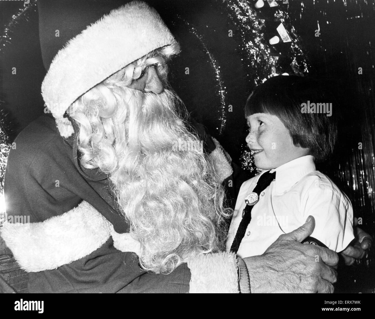 A young girl meeting Father Christmas in the grotto at Debenham's ...