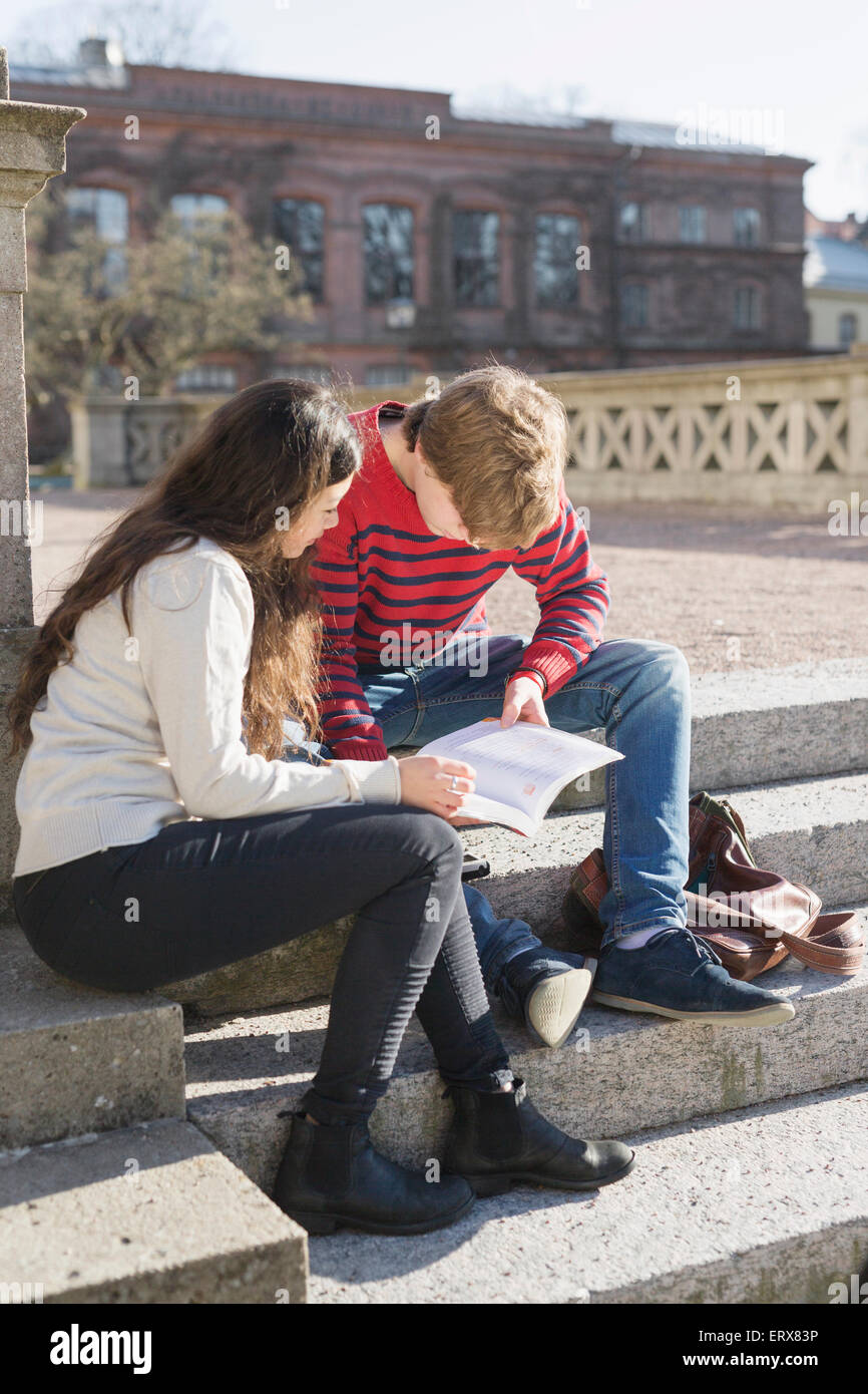 Indian boy girl reading hi-res stock photography and images - Alamy