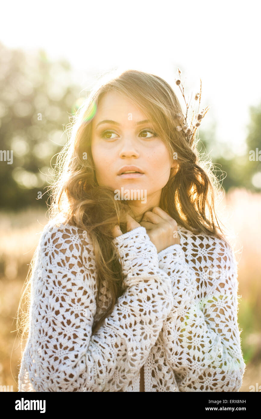 Beautiful lady model in open field at sunrise Stock Photo - Alamy
