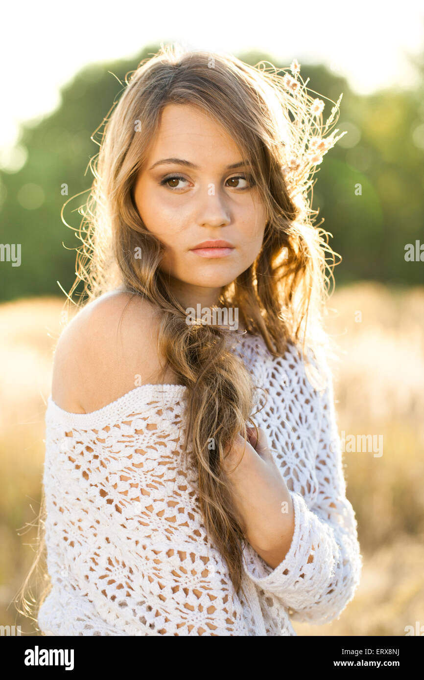 Beautiful model in open field at sunrise Stock Photo - Alamy