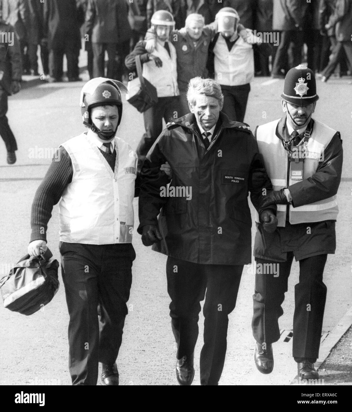 Miners Strike 1984 - 1985 Pictured. Police Officer injured is helped to ...