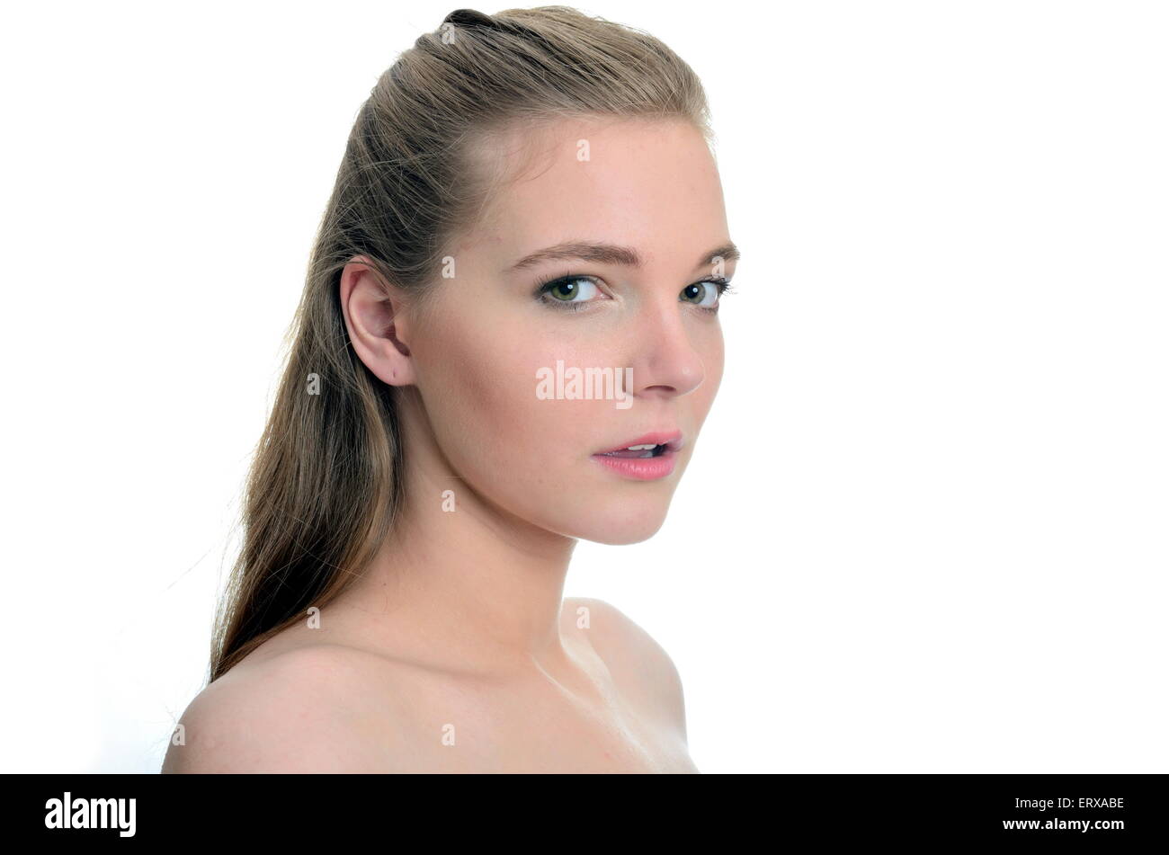 Young girl with kind and soft face expression. Portrait of female model ...